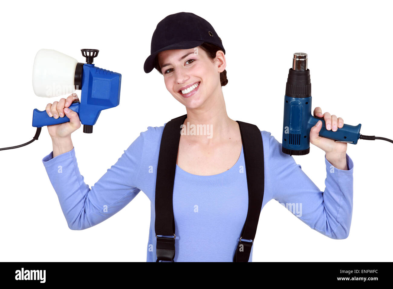 Woman holding paint sprayer and heat gun Stock Photo - Alamy