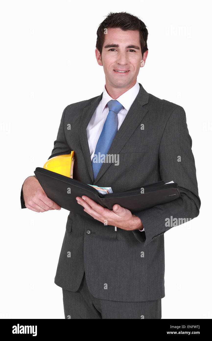 Engineer reviewing paperwork Stock Photo - Alamy