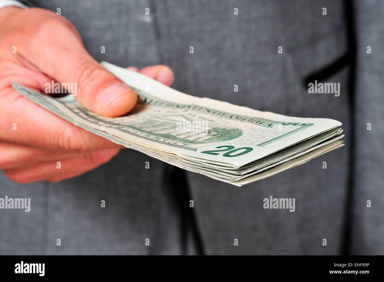 Wad of cash and man hi-res stock photography and images - Alamy
