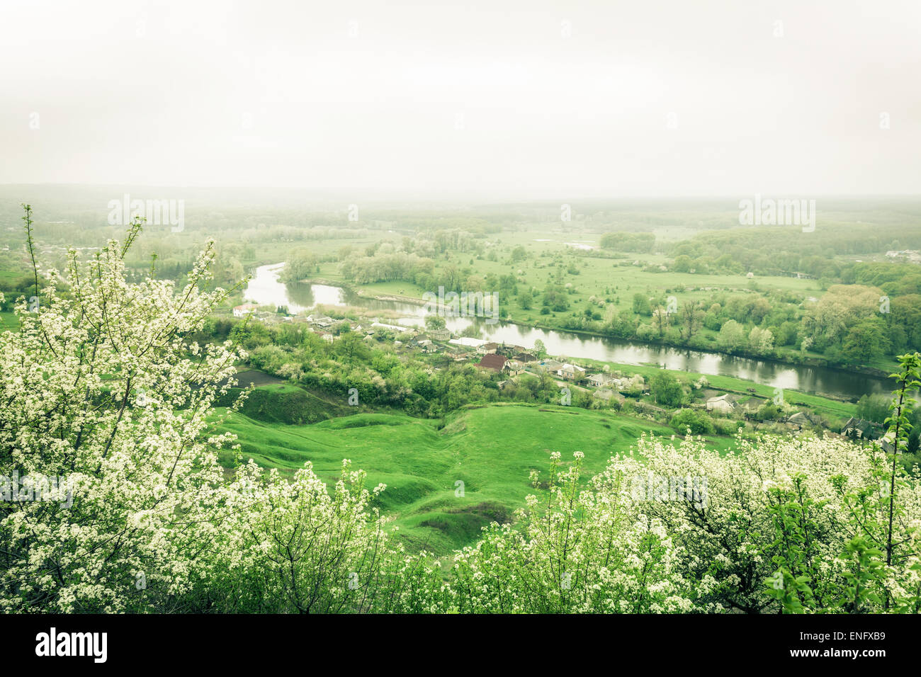 village and river landscape view from hill in spring Stock Photo - Alamy