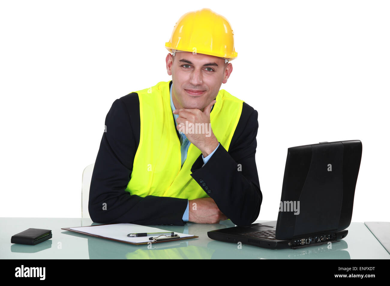 Engineer sitting with a laptop Stock Photo - Alamy