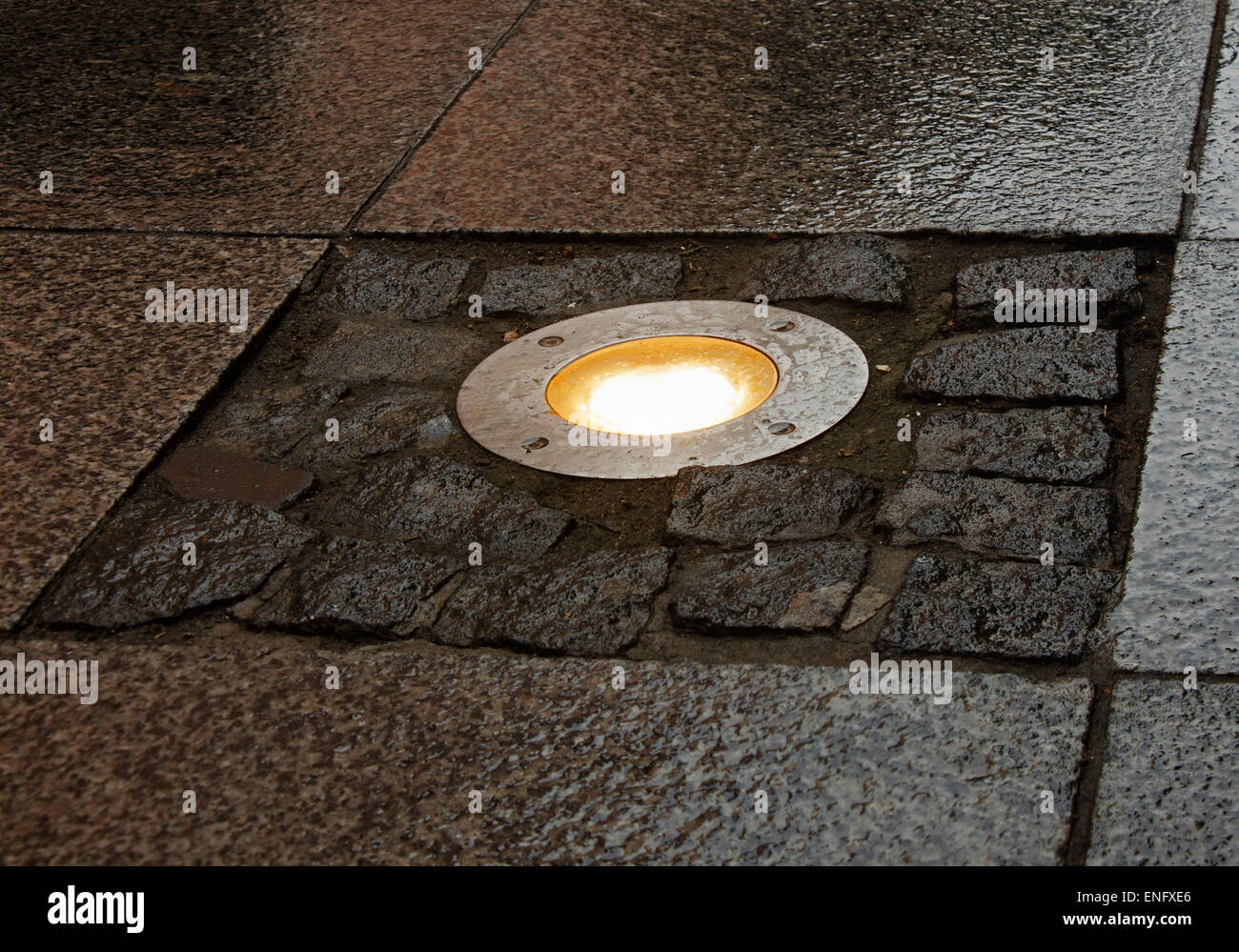 alight lamp in pavement in Lviv Stock Photo - Alamy