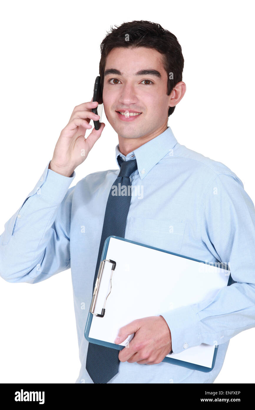 Man with clip-board making an important call Stock Photo - Alamy