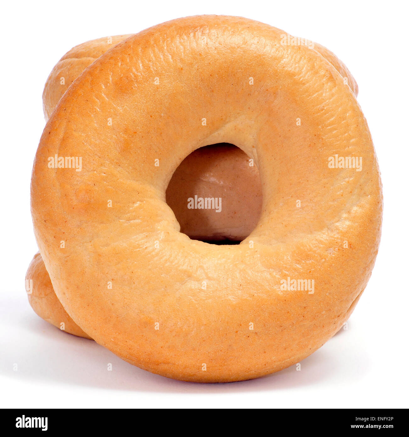 a pile of plain bagels on a white background Stock Photo - Alamy