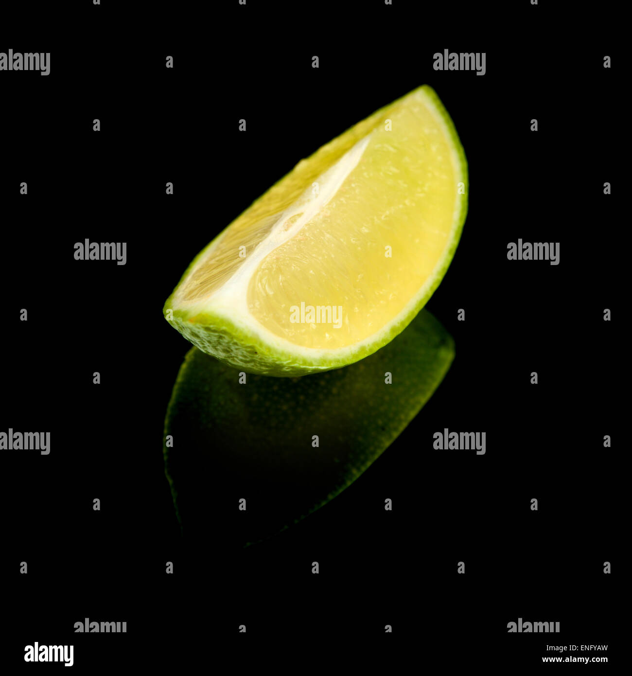 lime fruit on black mirror, isolated Stock Photo - Alamy