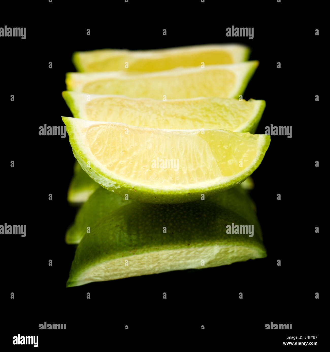 lime fruit on black mirror, isolated Stock Photo - Alamy