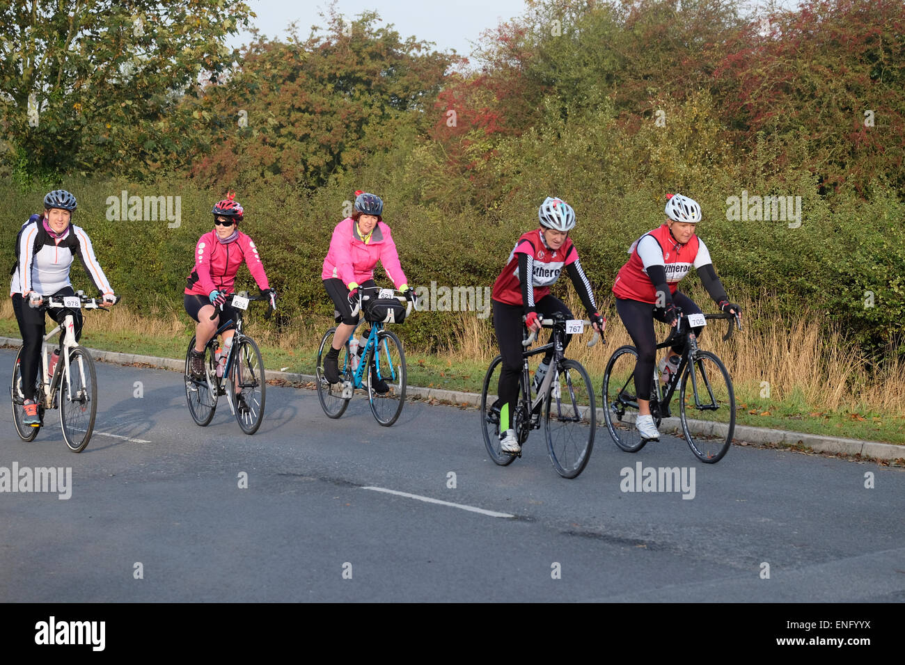 Female cyclists set out on an organised bike ride Stock Photo - Alamy