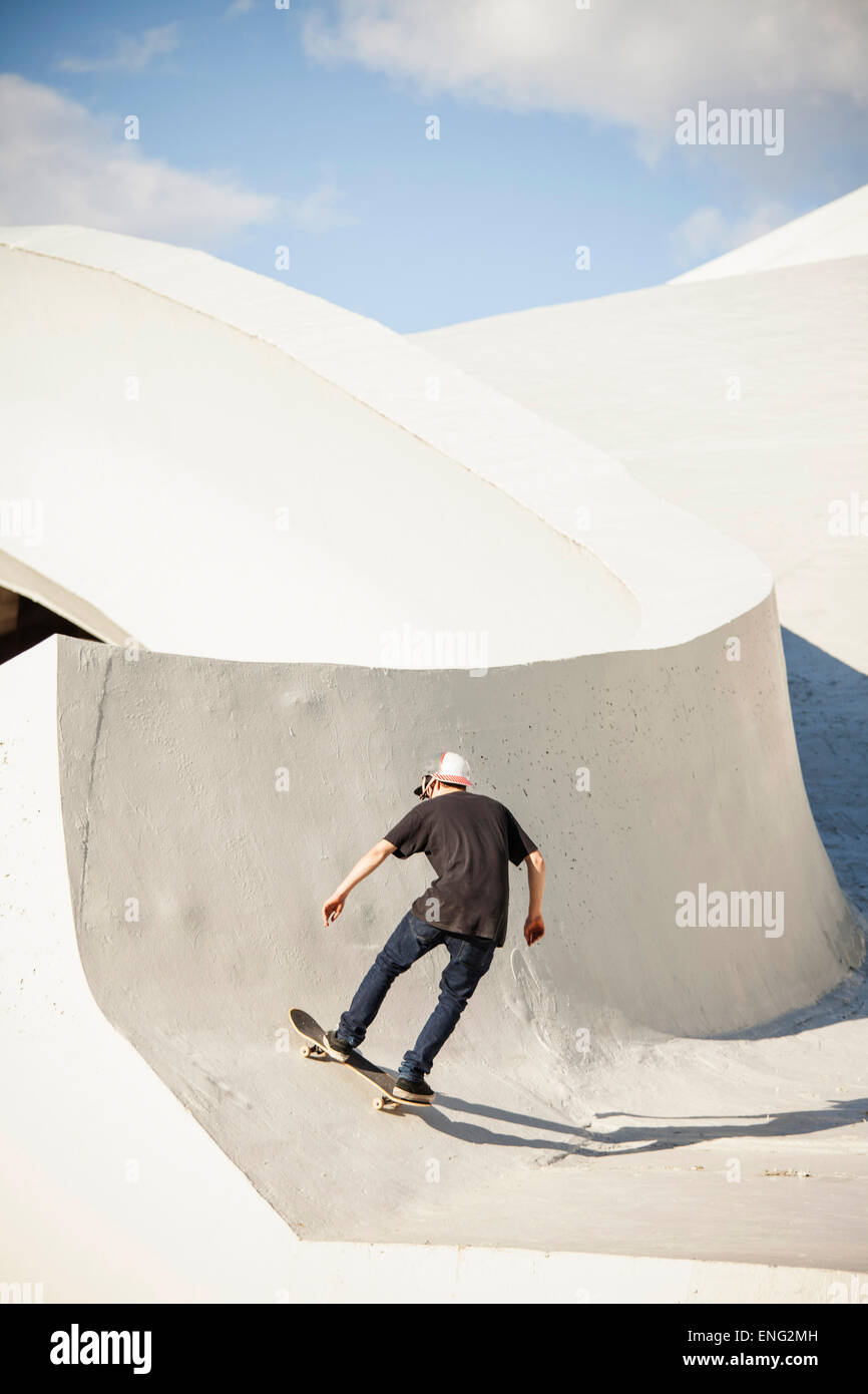 Caucasian man skating at skate park Stock Photo - Alamy