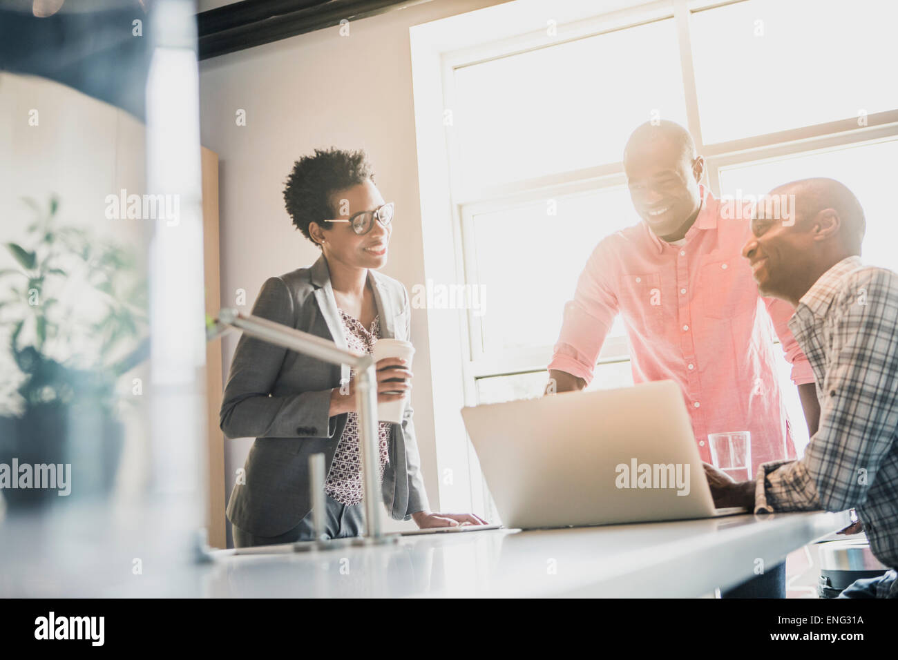 Business people talking in office kitchen Stock Photo - Alamy
