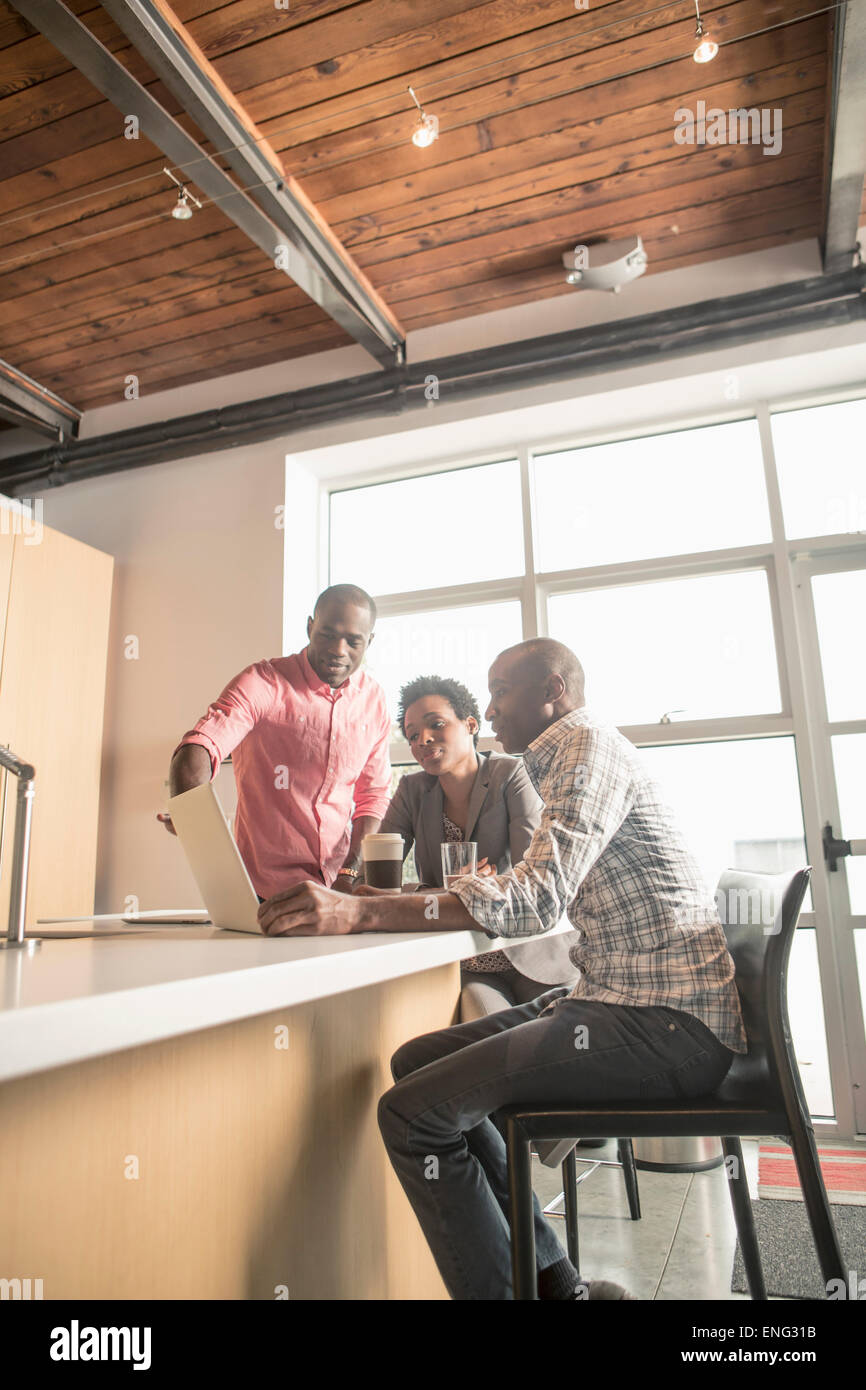 Business people talking in office kitchen Stock Photo - Alamy