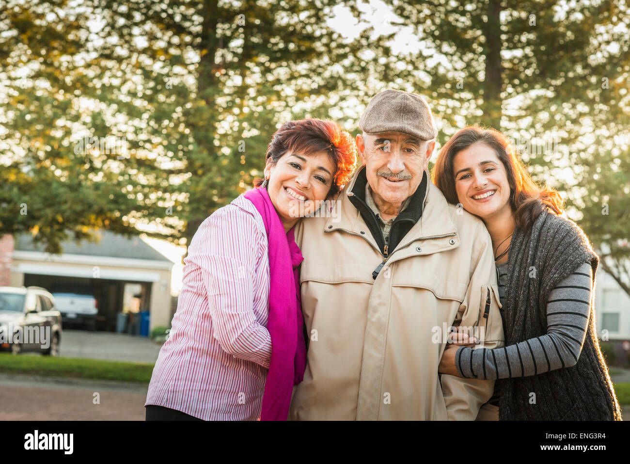 Hispanic parents and daughter smiling outdoors Stock Photo - Alamy