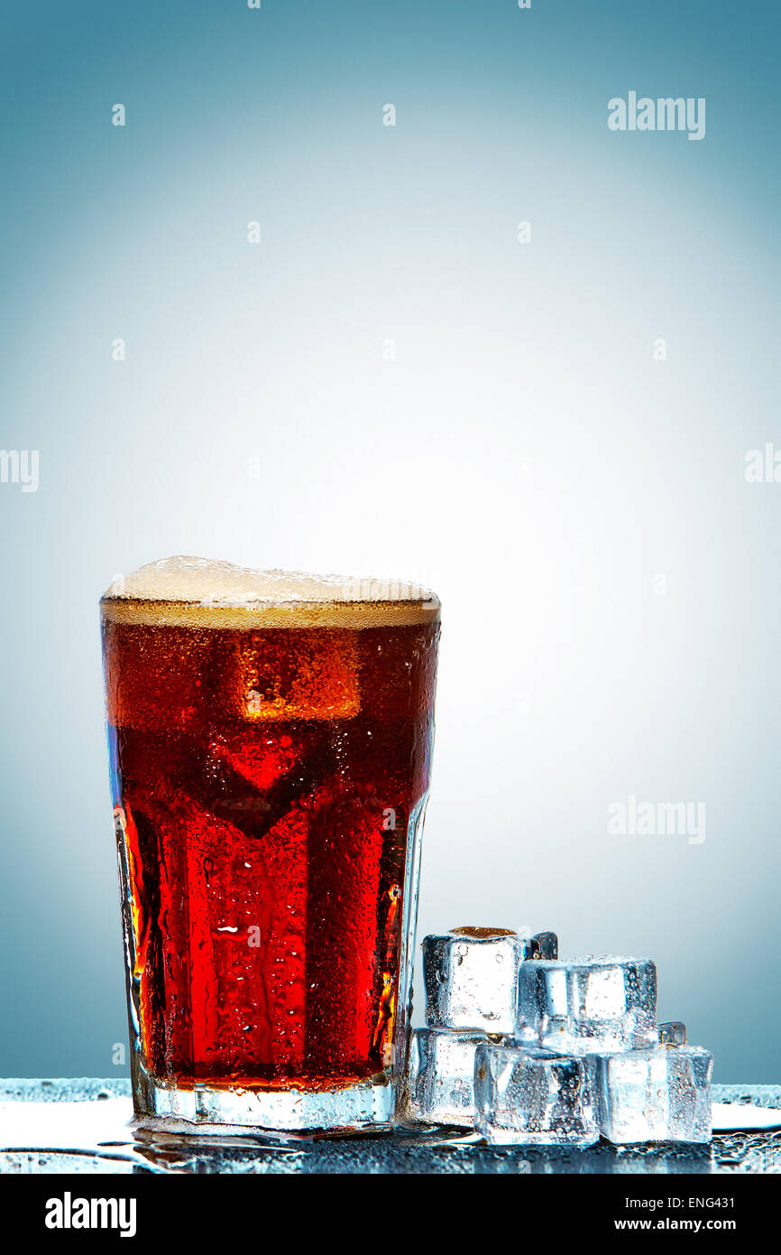Glass of cola with ice cubes Stock Photo - Alamy