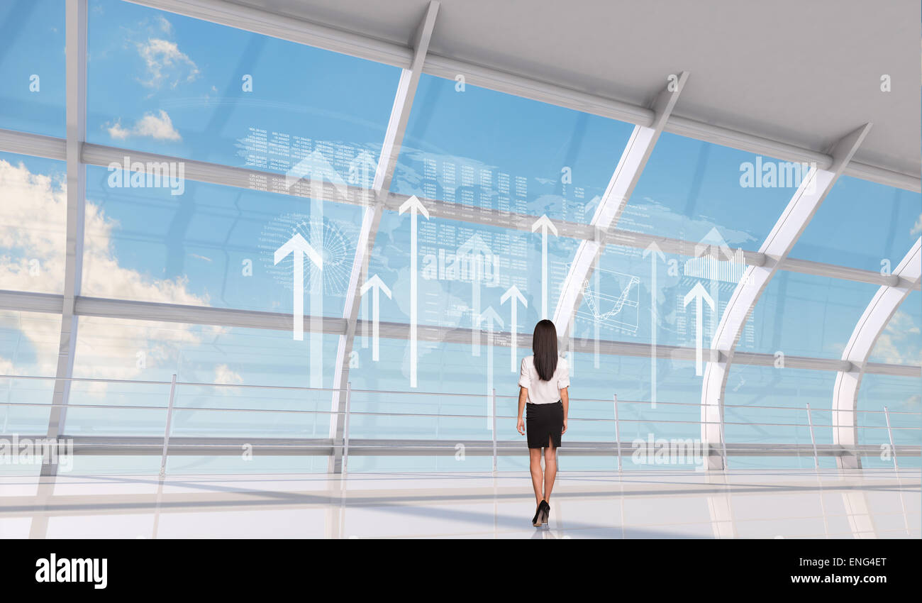 Young lady standing back Stock Photo - Alamy