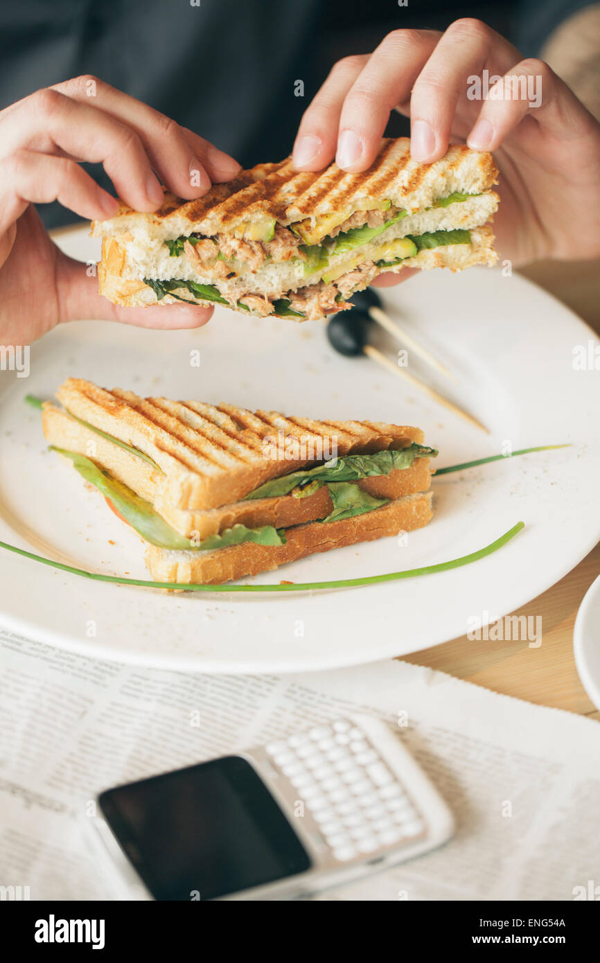 Close up of man eating sandwich Stock Photo - Alamy