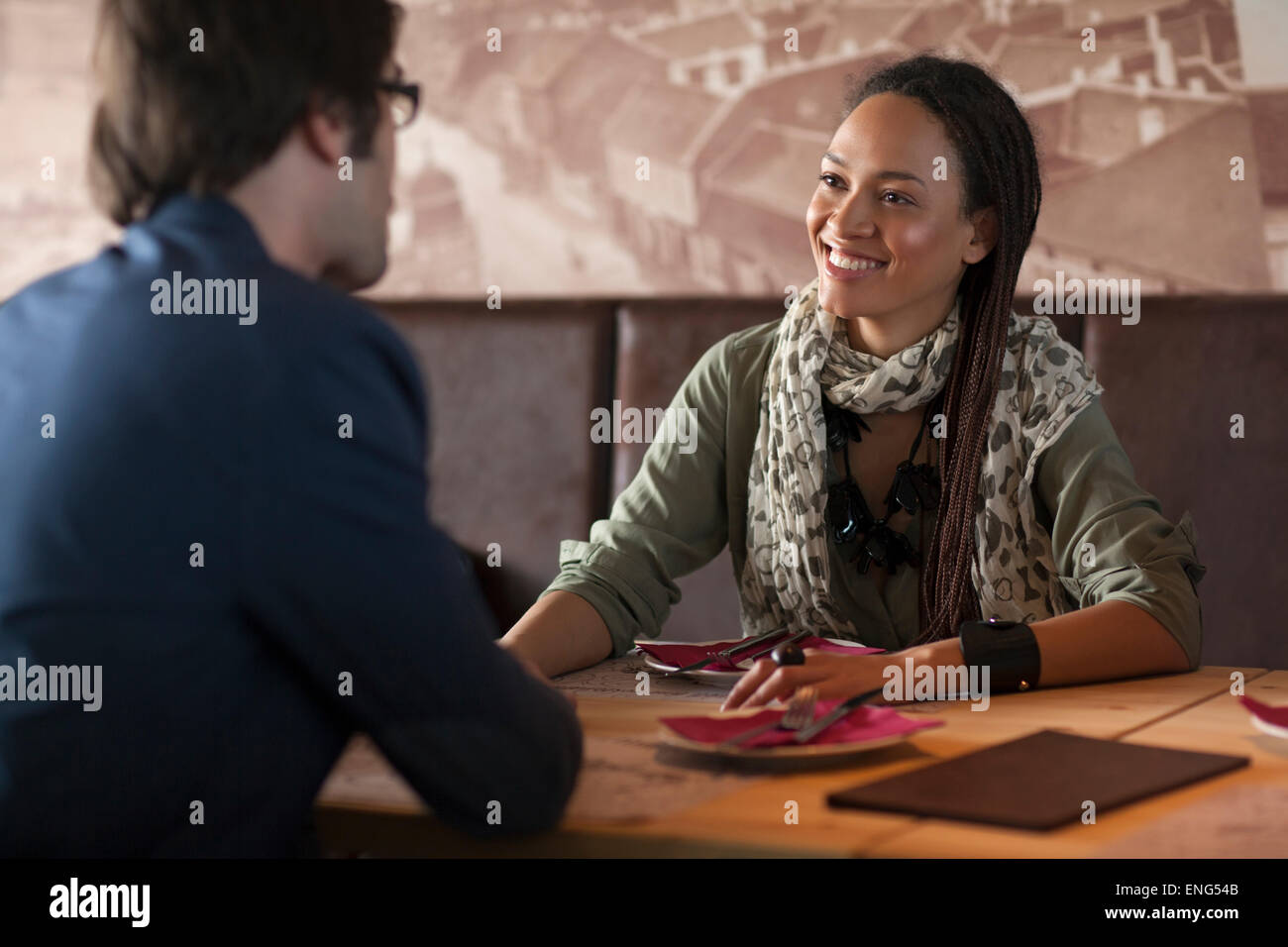 Smiling couple talking in cafe Stock Photo - Alamy