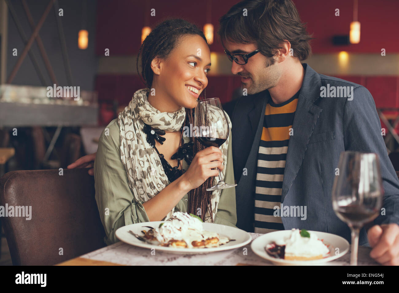 Couple eating dinner in cafe Stock Photo - Alamy