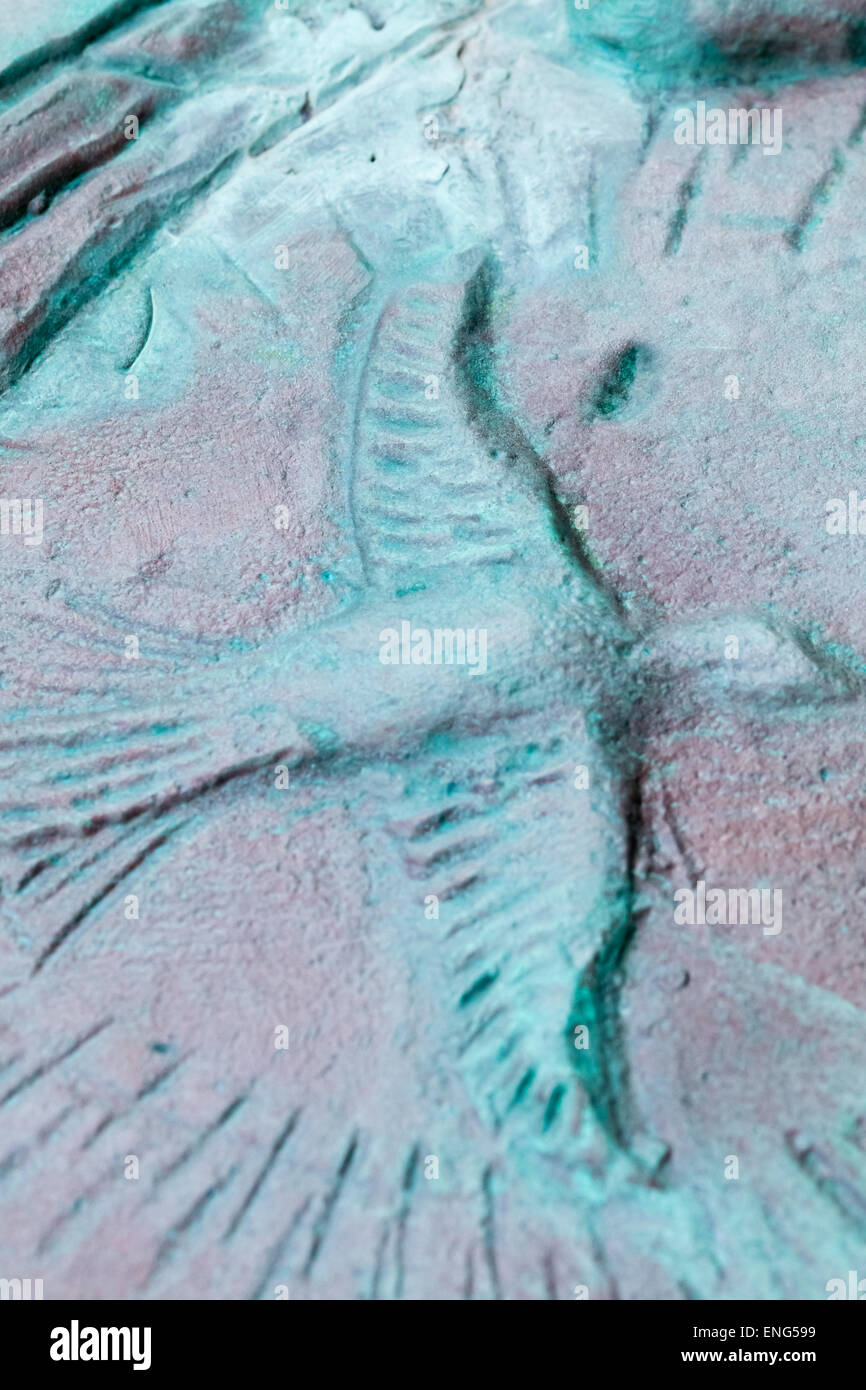 Raised bronze shape in a church door Stock Photo - Alamy