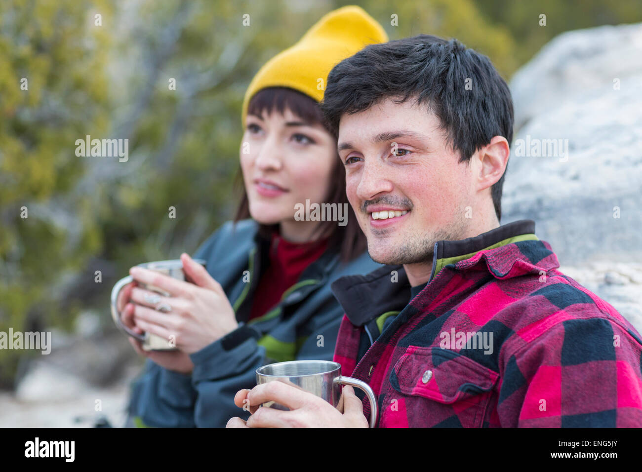 Couple sharing coffee on rock formations Stock Photo - Alamy