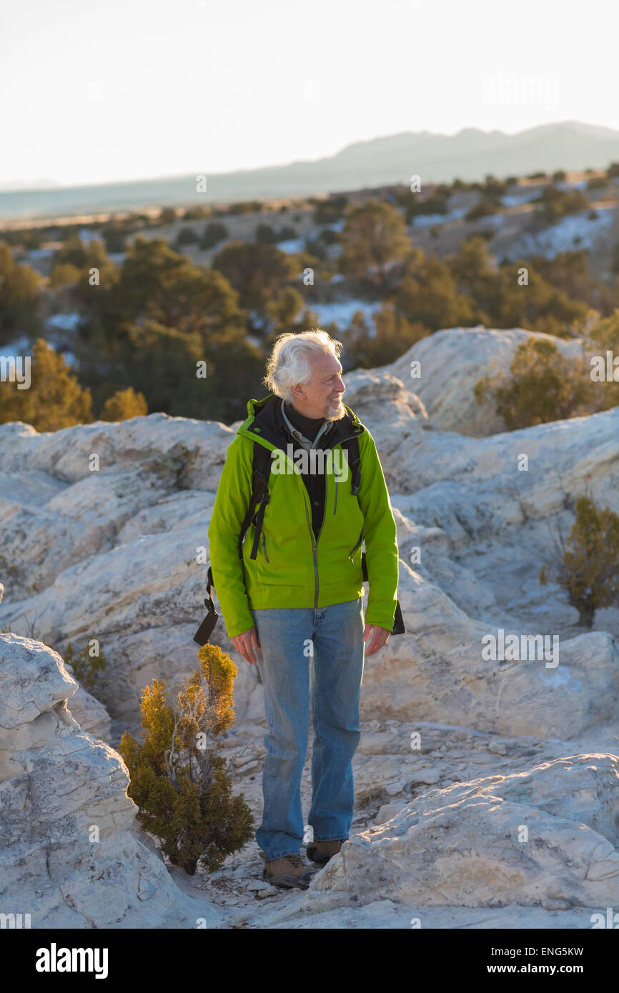 Older man standing on remote rock formations Stock Photo - Alamy