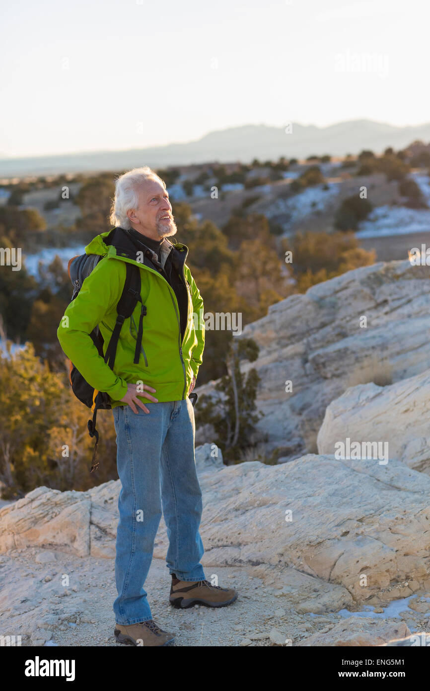 Older man standing on remote rock formations Stock Photo - Alamy