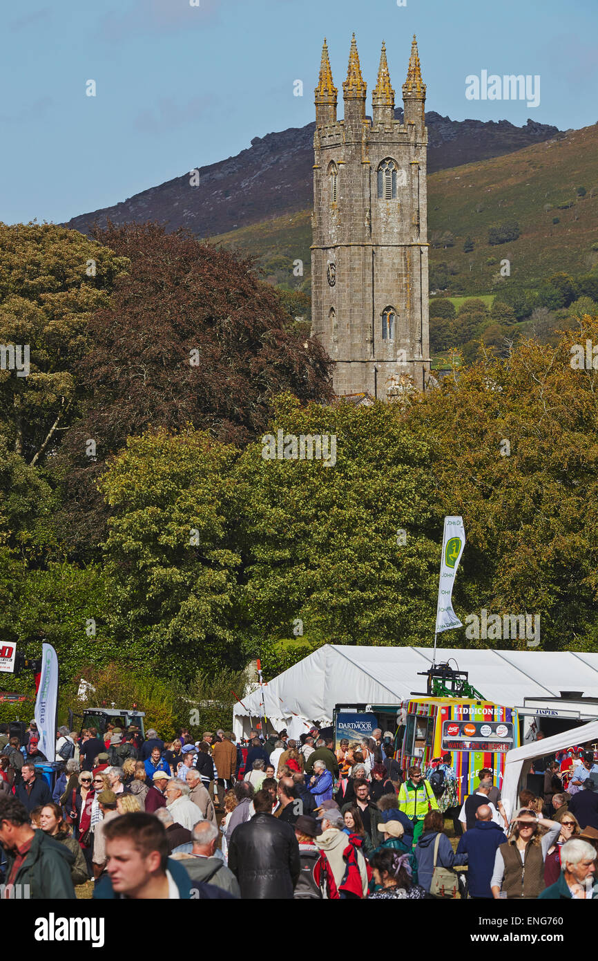 A church tower stands above Widecombe Fair, Widecombe, Dartmoor ...