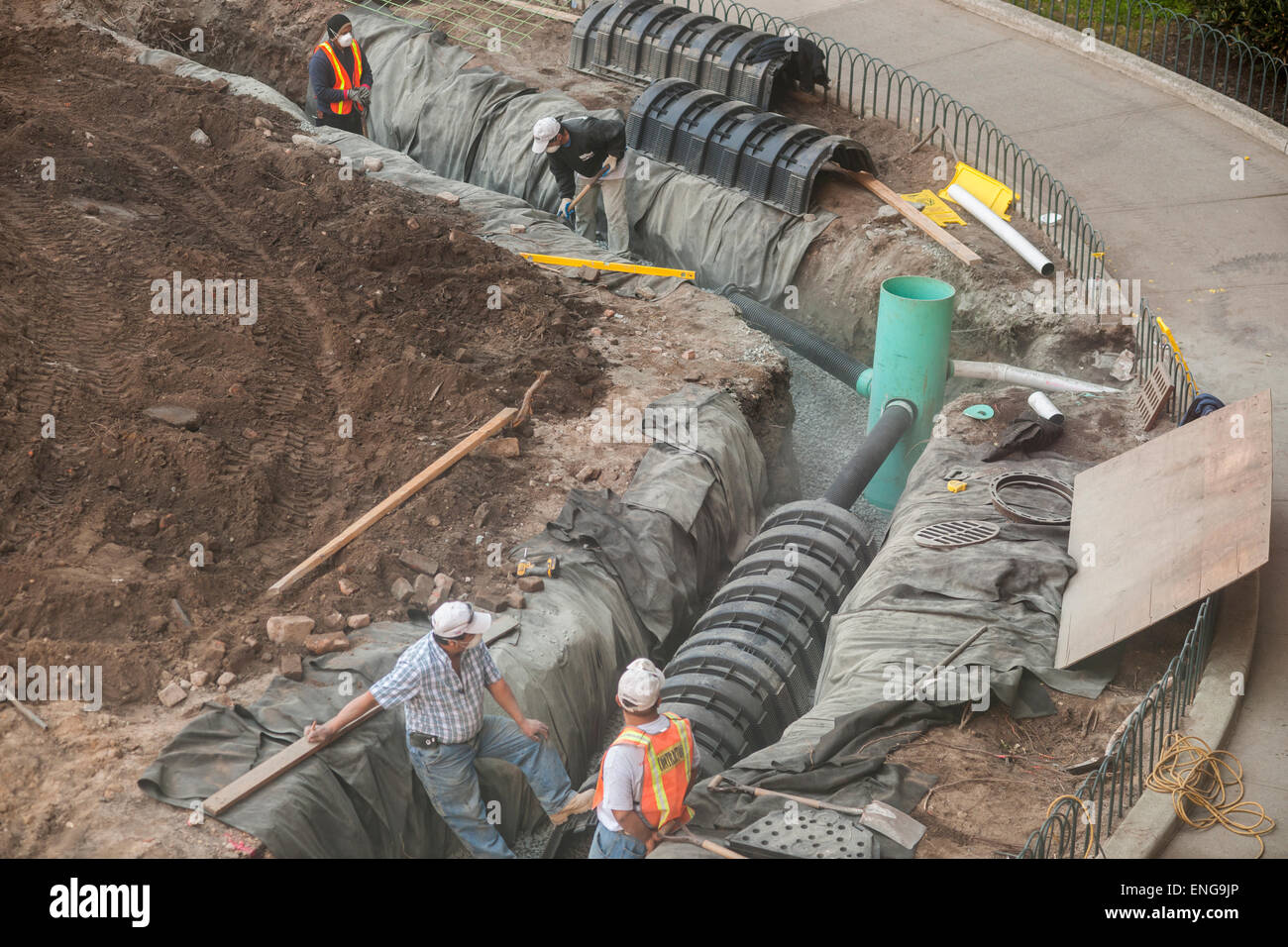 Construction of a drainage improvement project in front of an apartment ...