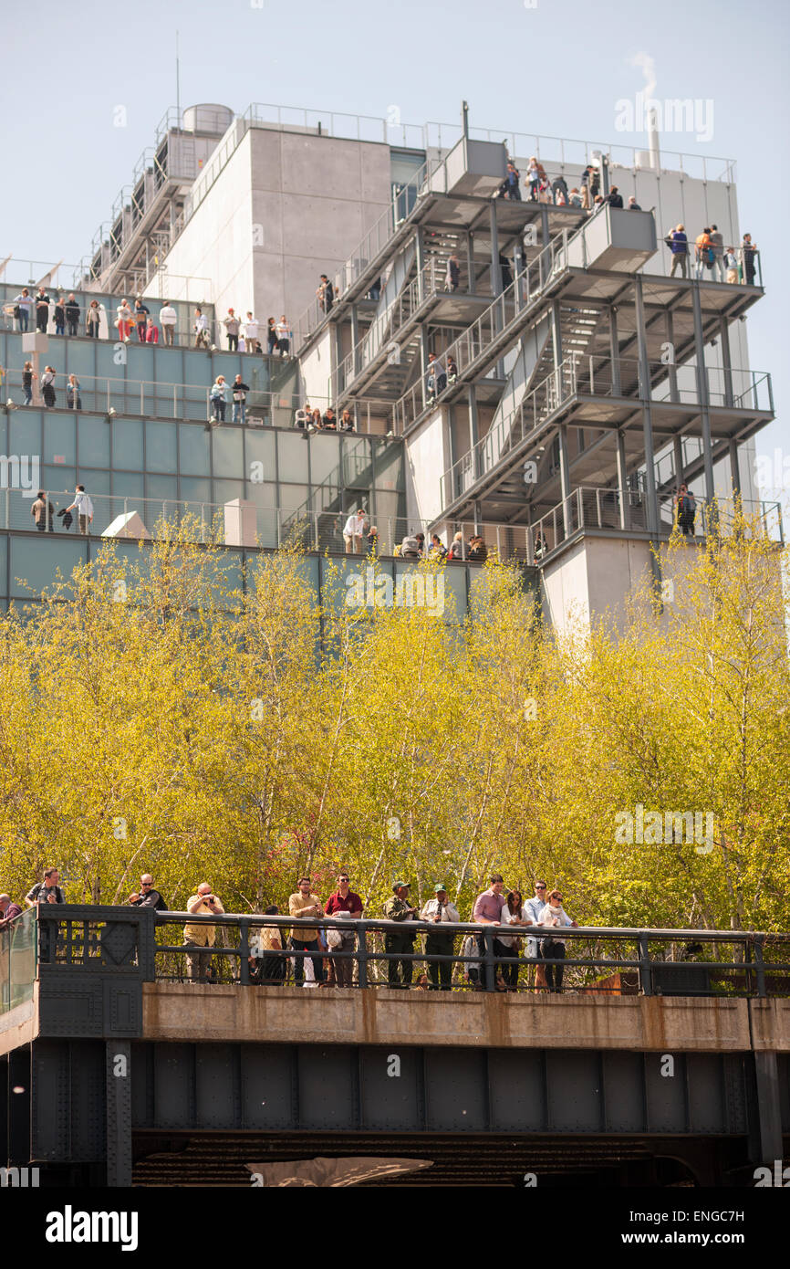 Visitors crowd the balconies of the Whitney Museum of American Art ...