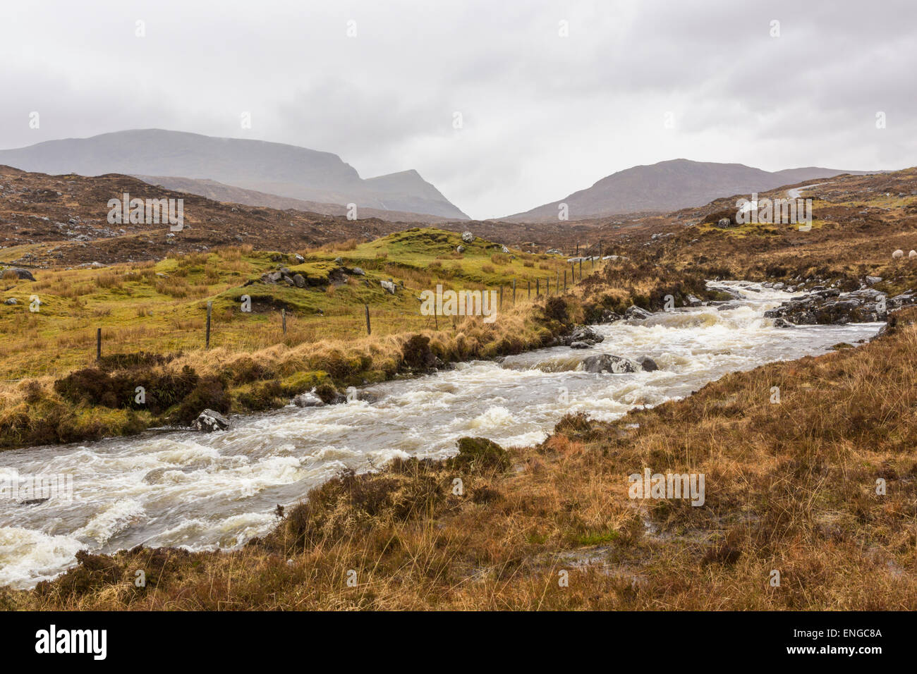 A fast flowing river flowing down a hill on the Isle of Harris ...