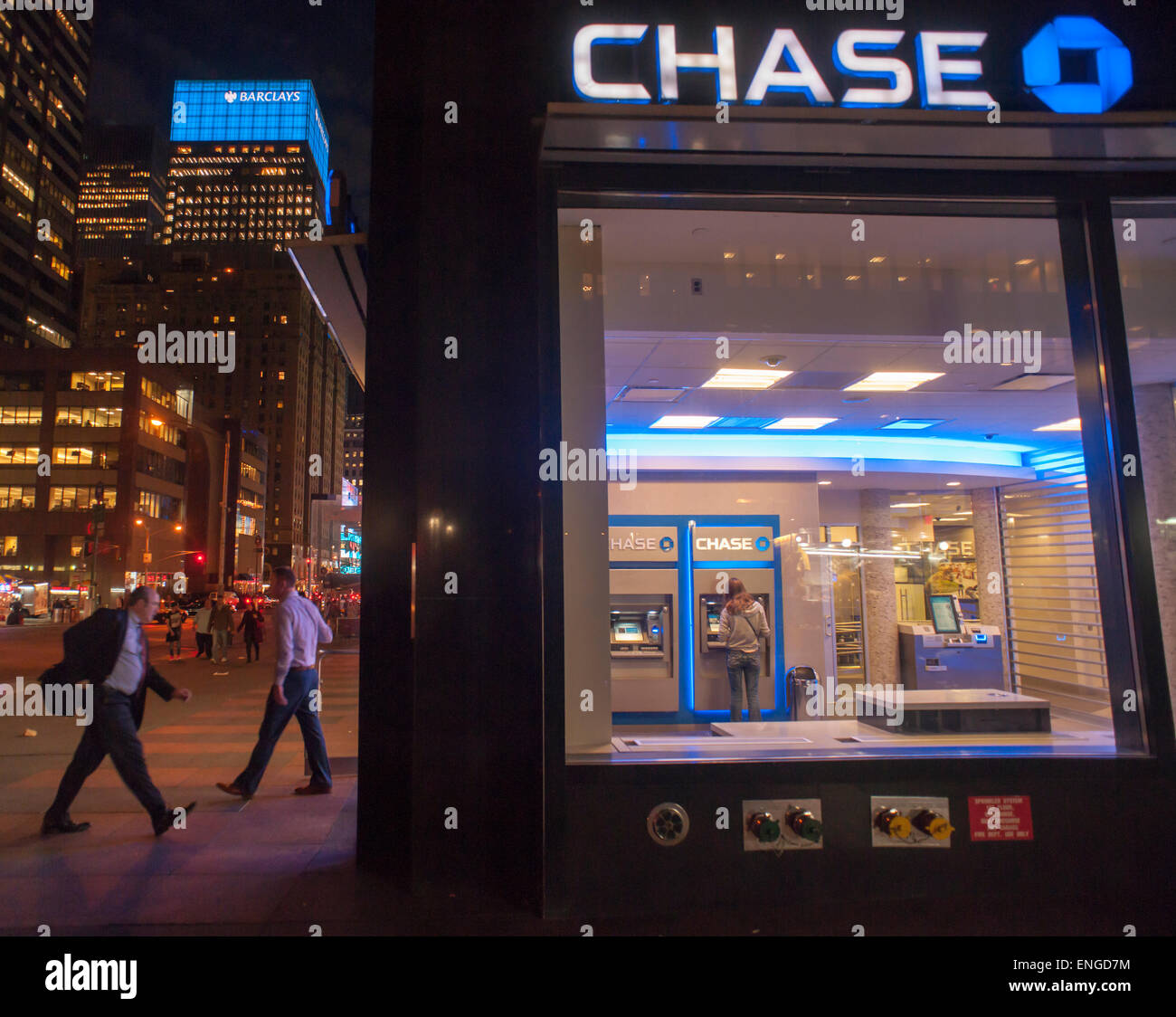 Customers use the ATM machines at a JPMorgan Chase bank in Midtown in ...