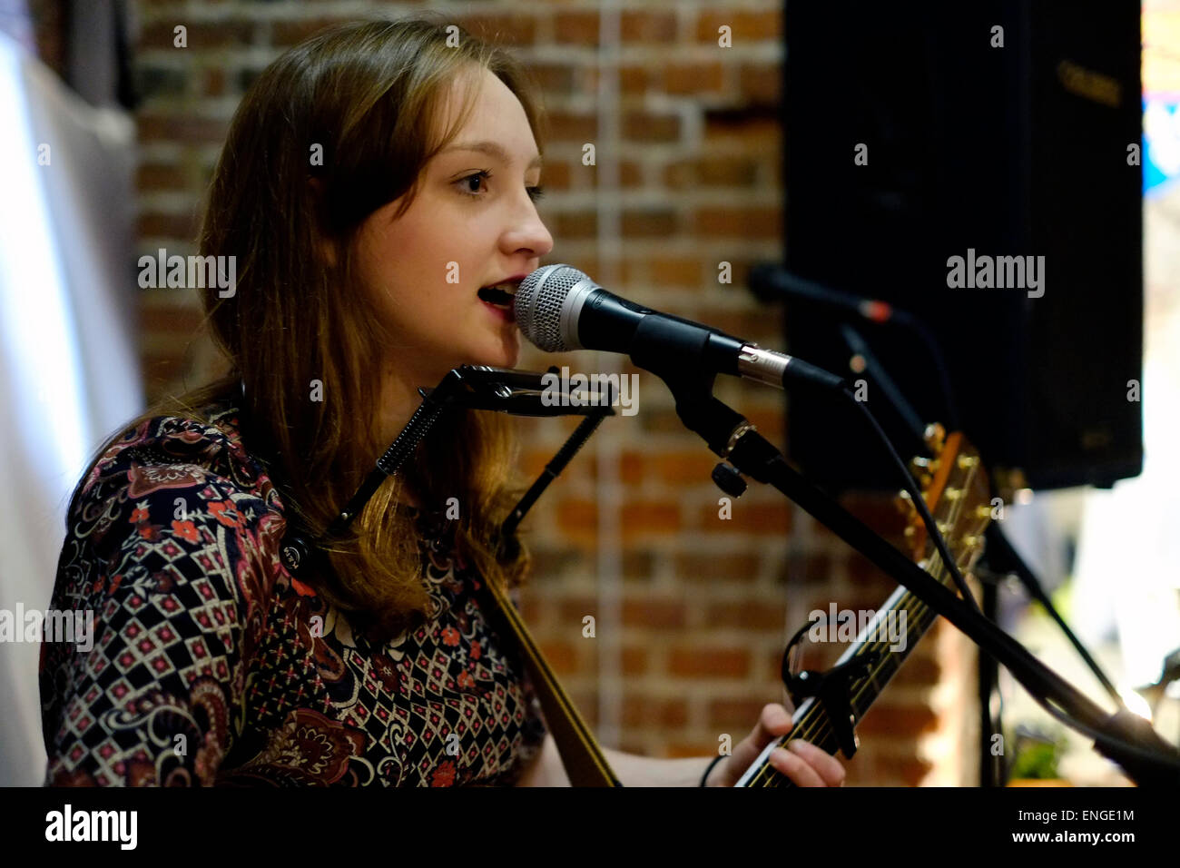 local young female musician megan linford plays an acoustic set at the ...