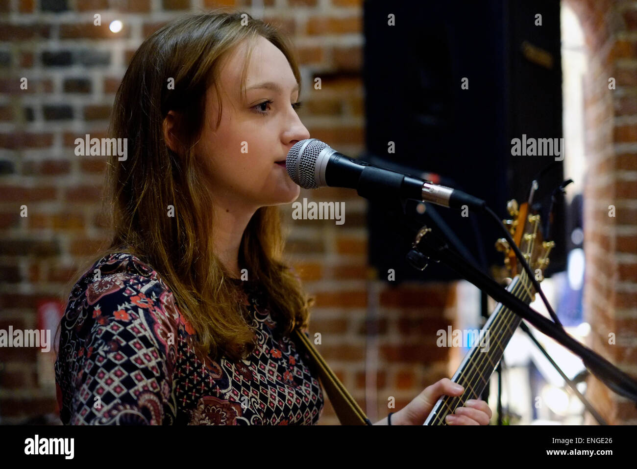 local young female musician megan linford plays an acoustic set at the ...