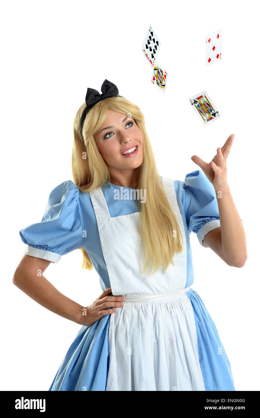 Beautiful young woman dressed in costume throwing playing cards into ...