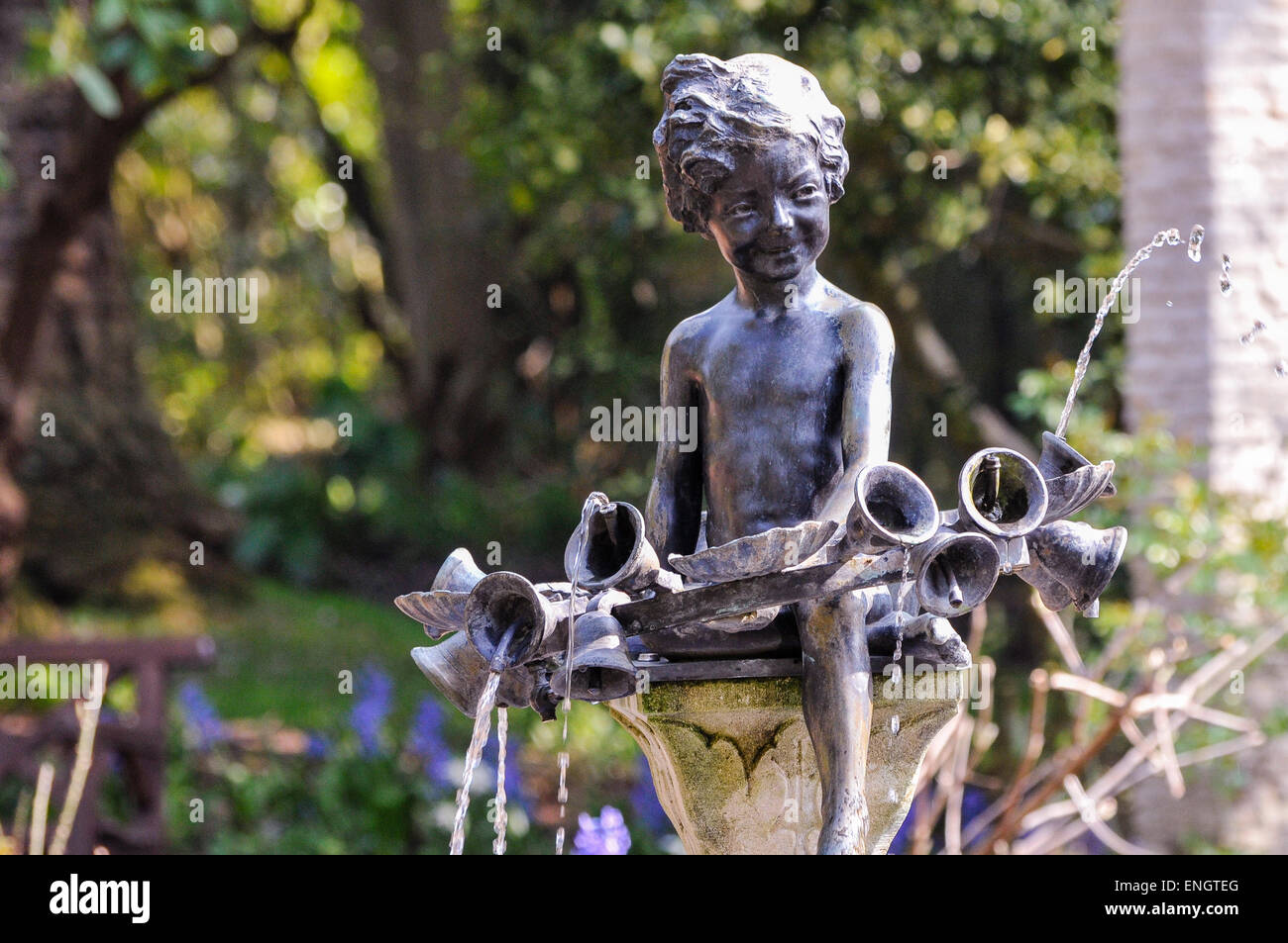 Bronze water fountain in the shape of a young boy with bells Stock ...
