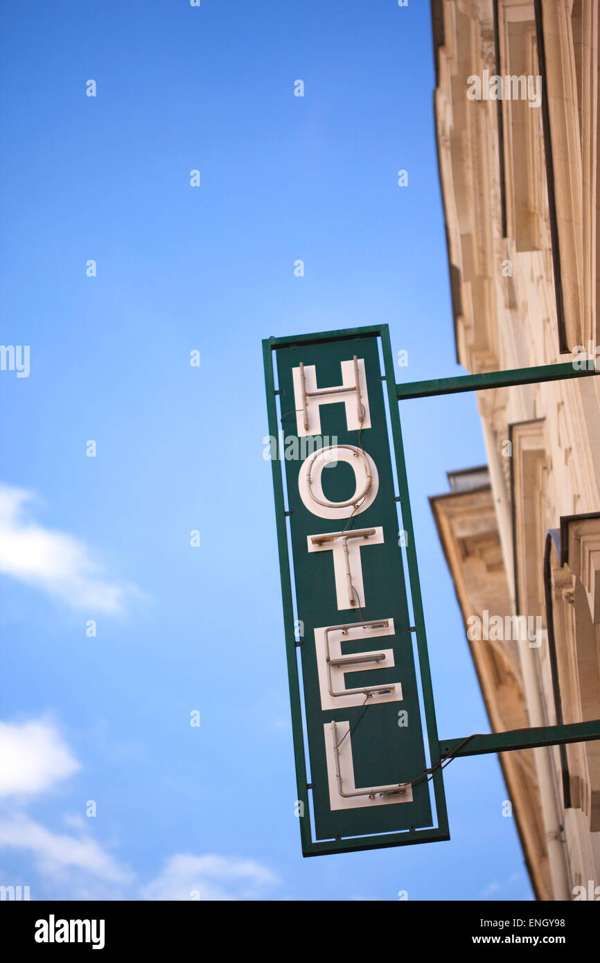 Hotel neon sign on a facade in town Stock Photo - Alamy