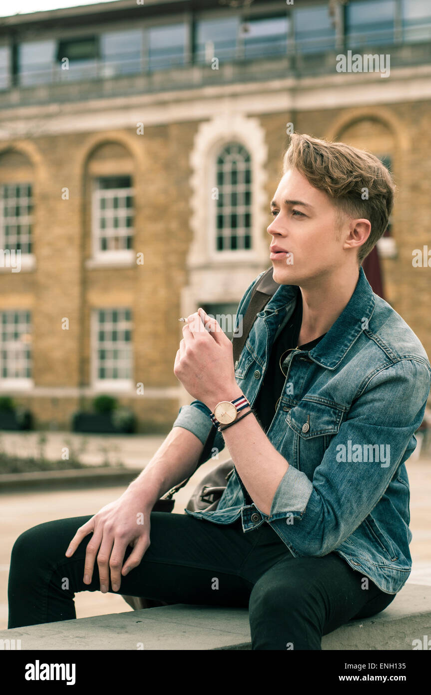 Young blond man smoking in hi-res stock photography and images - Alamy