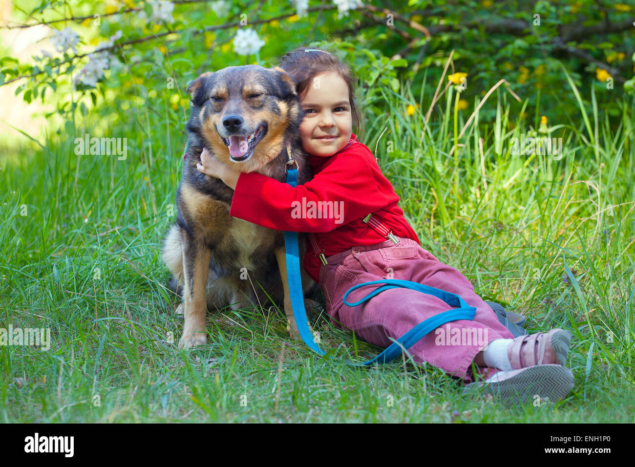 Child embracing dog hi-res stock photography and images - Alamy