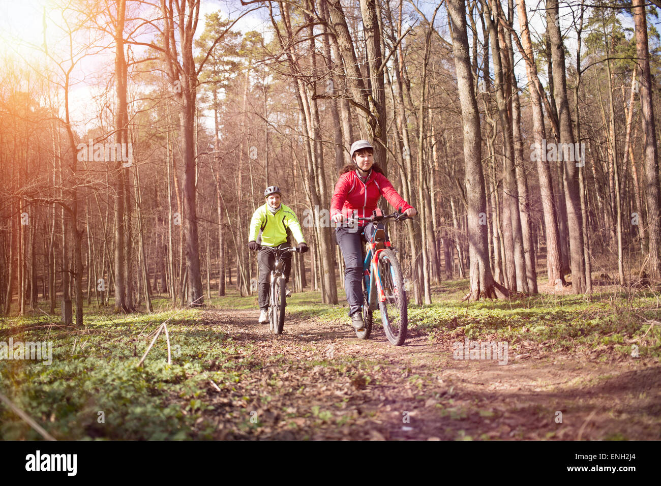 Young people riding bikes Stock Photo - Alamy