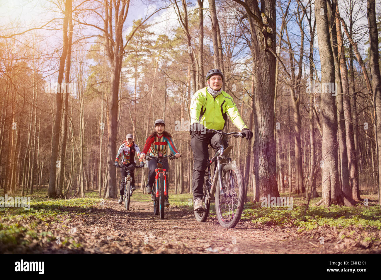 Young people riding bikes Stock Photo - Alamy
