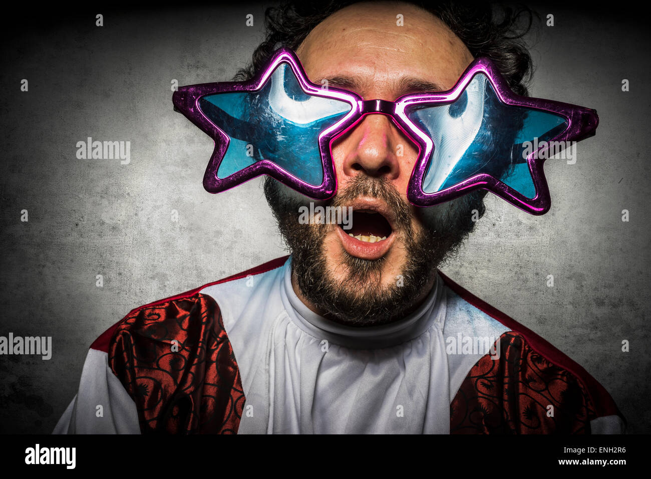 Nerd, stupid man with glasses graceful gestures and ridiculous party ...