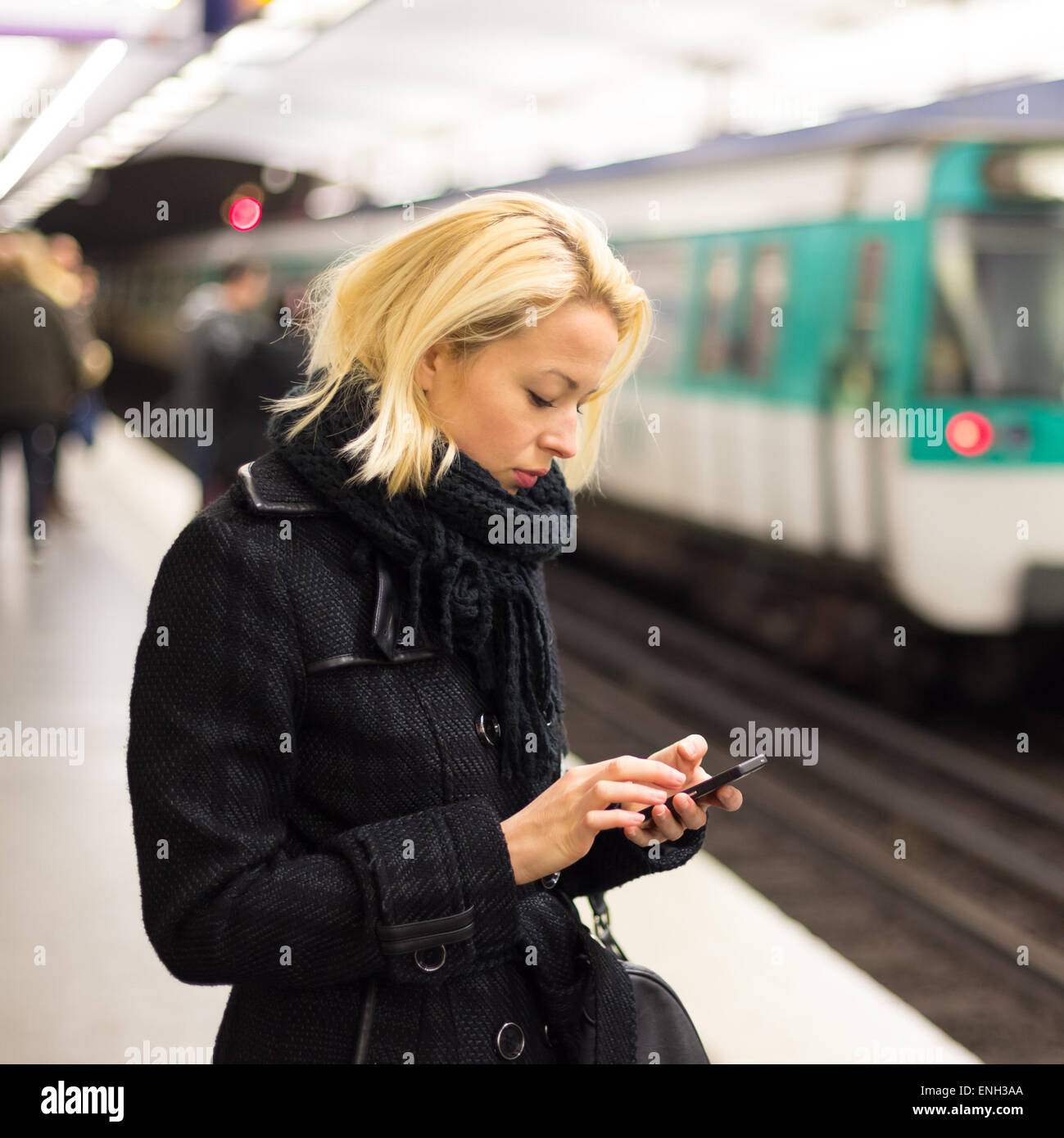 Woman on a subway station Stock Photo - Alamy