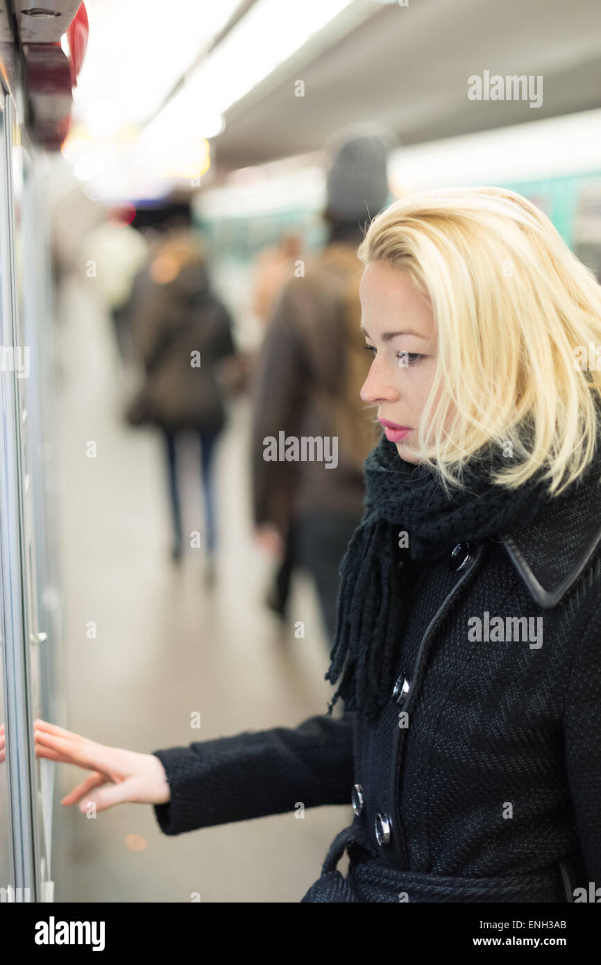 Lady buying ticket for public transport Stock Photo - Alamy