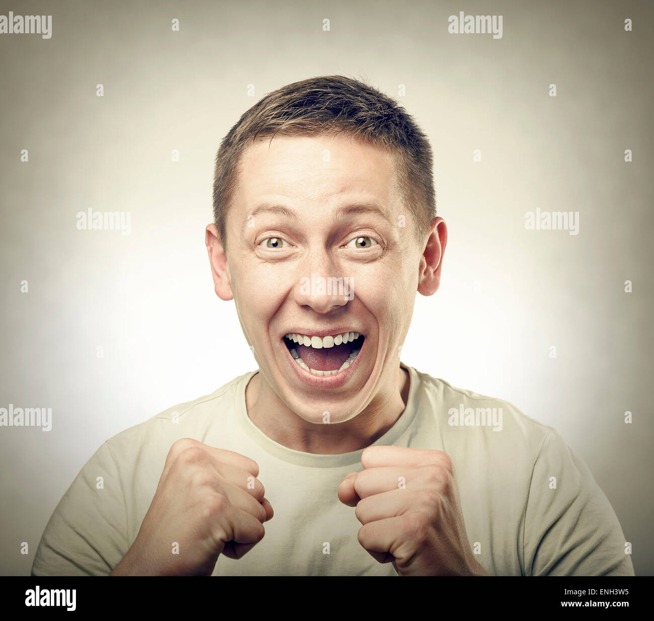 Young man celebrating success Stock Photo - Alamy