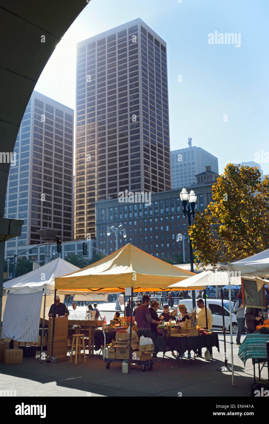 Farmers Market stalls on the Embarcadero with contrasting big business ...