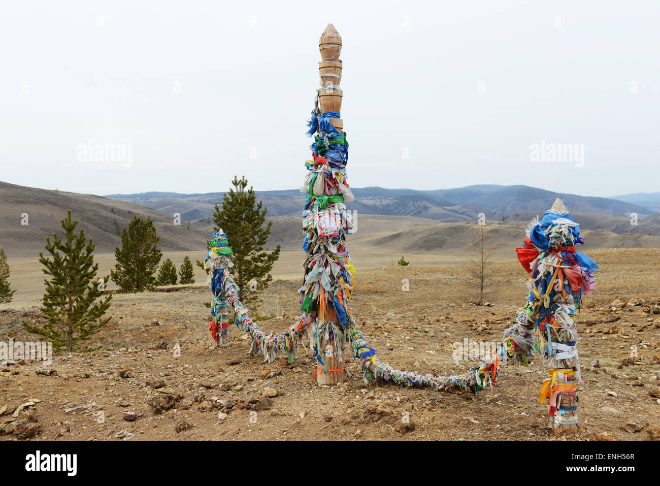 Wooden poles with colorful ribbons (important in shamanism) in a small ...