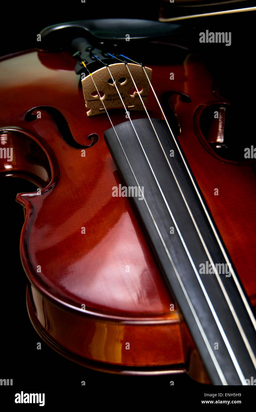 Violin close up with black background Stock Photo - Alamy