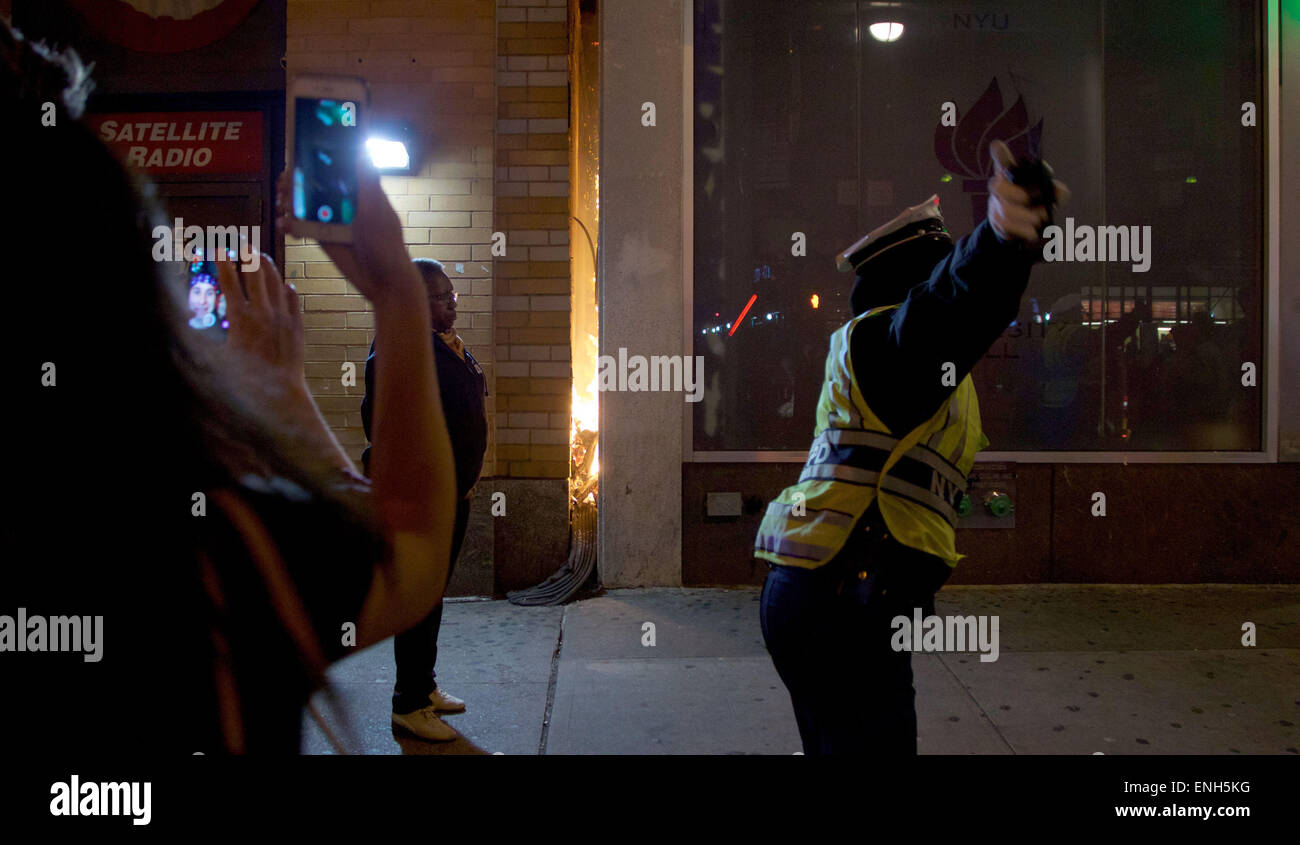 Flames from a fire at New York University's University Hall are visible ...