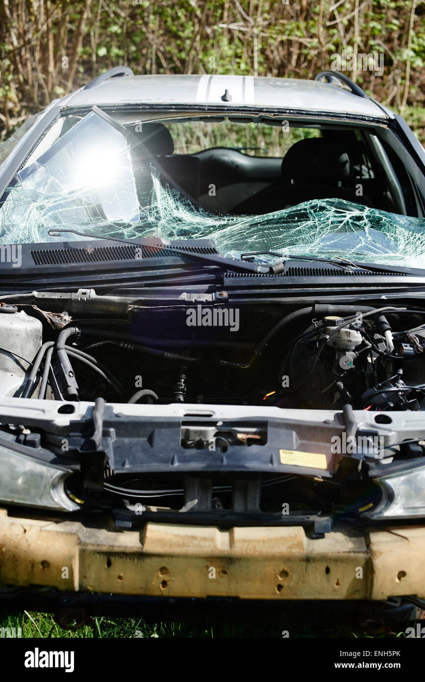 Junk Wrecked Car with Parts Removed in Wrecking Yard Stock Photo - Alamy