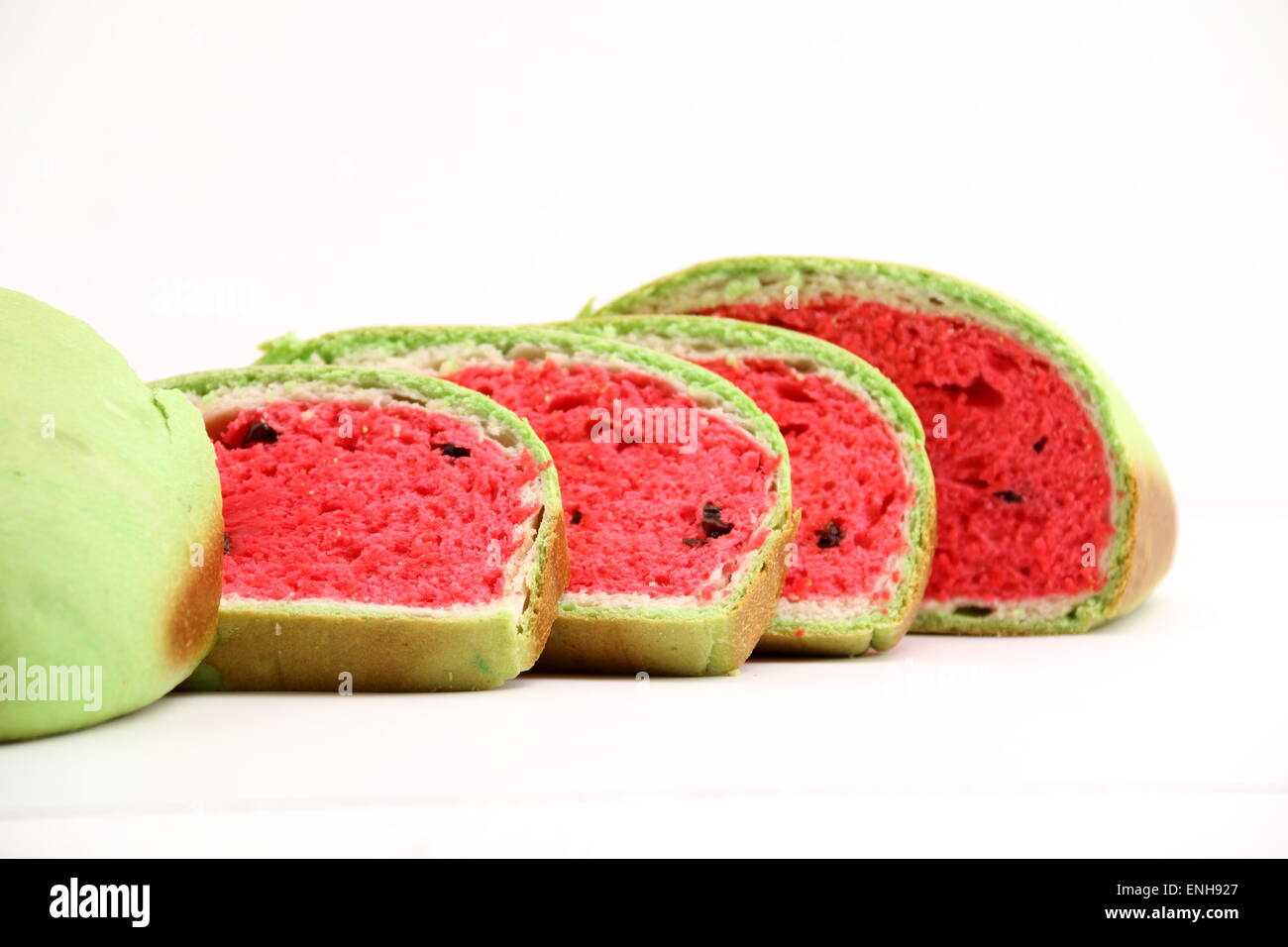 Sliced raisin red bread on white background Stock Photo - Alamy