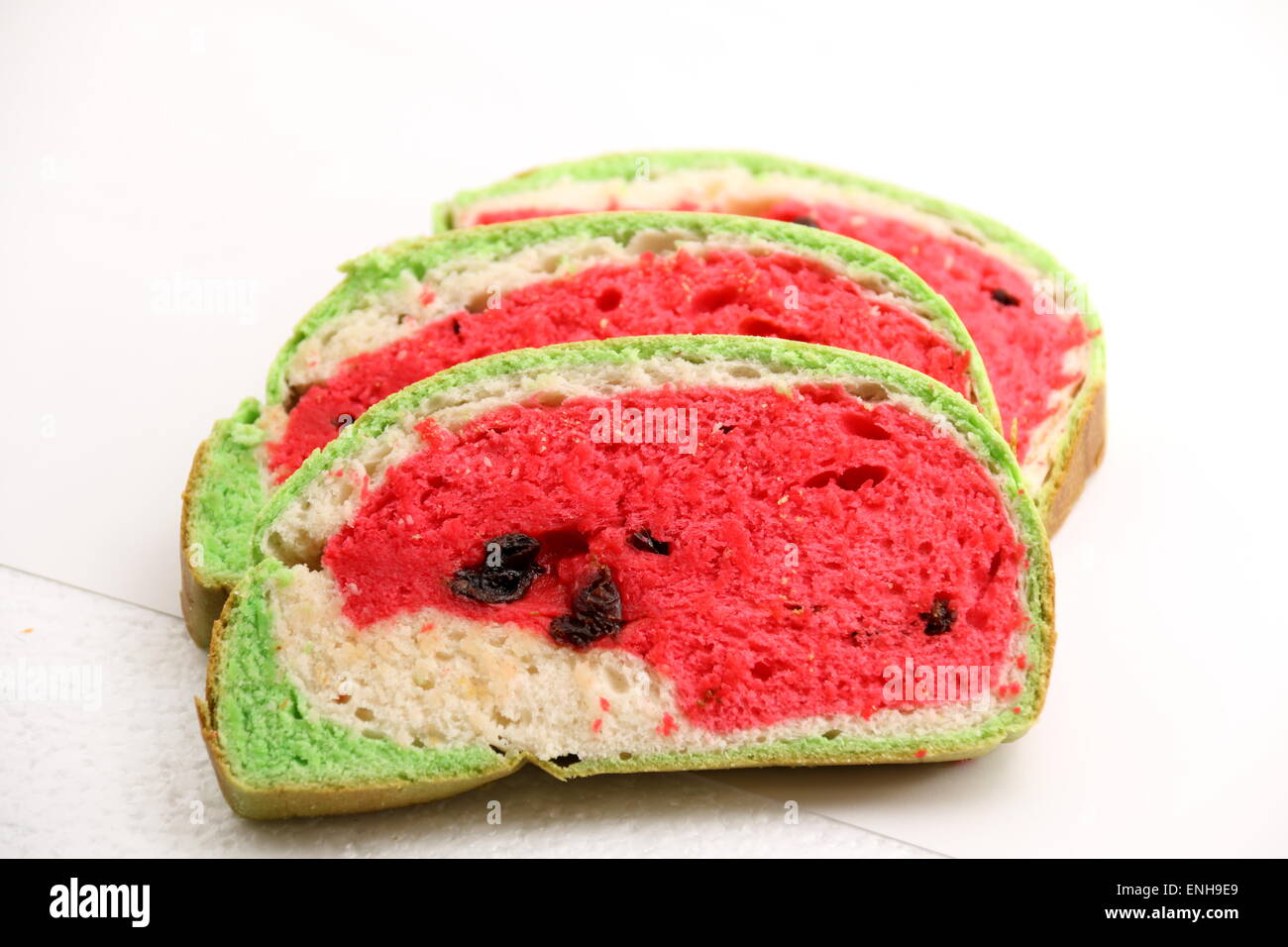 Sliced raisin red bread on white background Stock Photo - Alamy