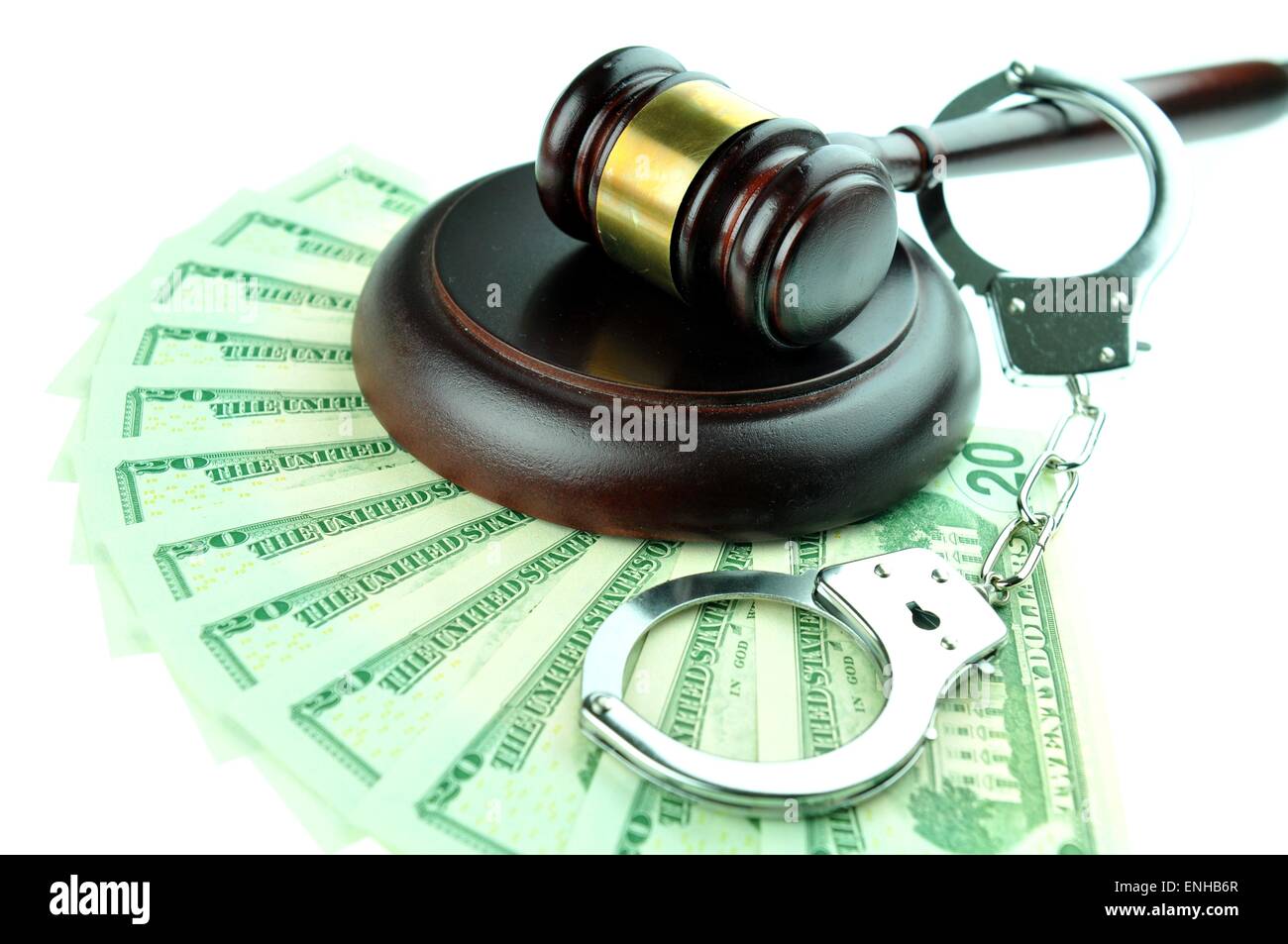Bribe concept with gavel and handcuffs isolated against white ...